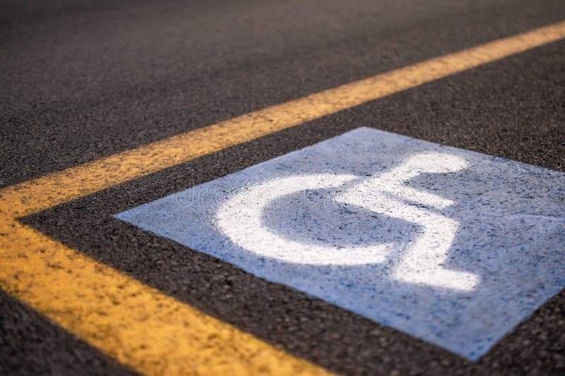 Parking Sign for Disabled on Asphalt with Yellow Lines Stock Photo ...