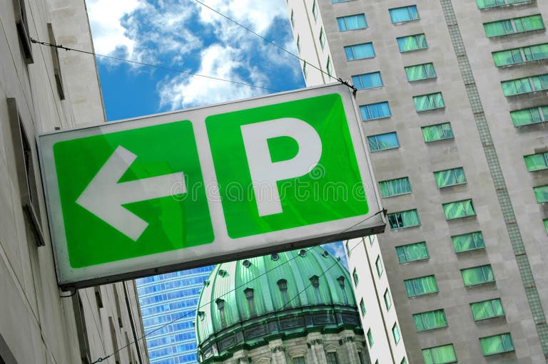 Parking sign in downtown stock image. Image of showing - 662251