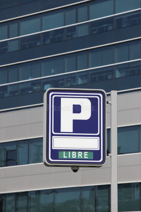 Parking Signpost with Libre Text and Modern Building Background Stock ...