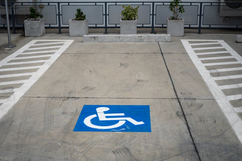 Parking Space for Disabled People with a Disabled Sign on the Floor ...