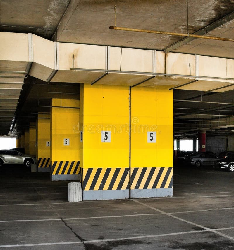 Parking under the building stock image. Image of number - 258553839