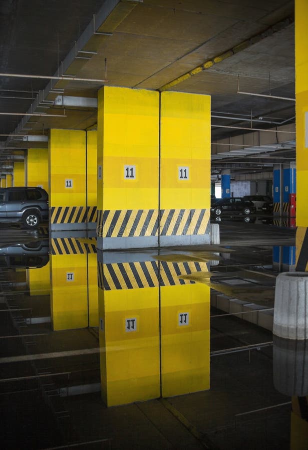 Parking under the building stock image. Image of puddle - 258468979