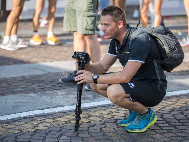 Video Camera Operator with a Small Video Camera on a Monopod during ...