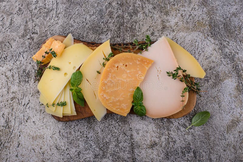 Parmesan, Cheddar, Gouda and Maasdam Cheese Stock Photo - Image of ...