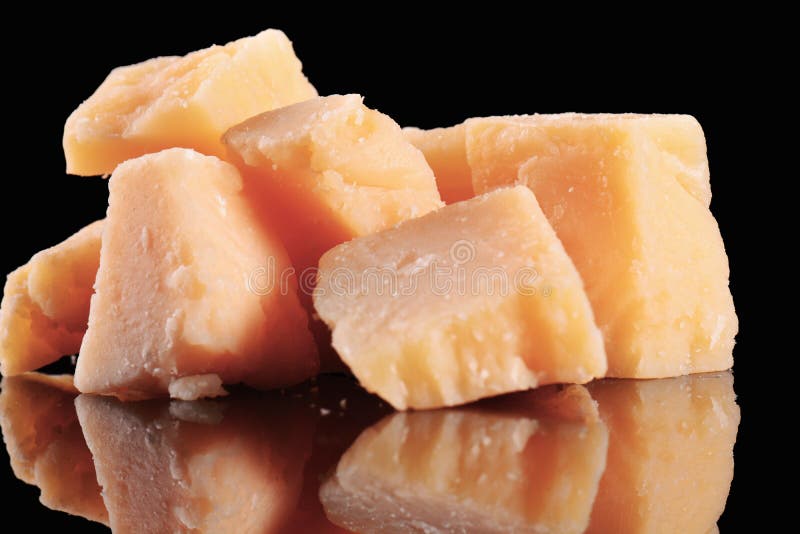 Parmesan Cheese on a Black Glossy Table with Reflection. Parmesan ...