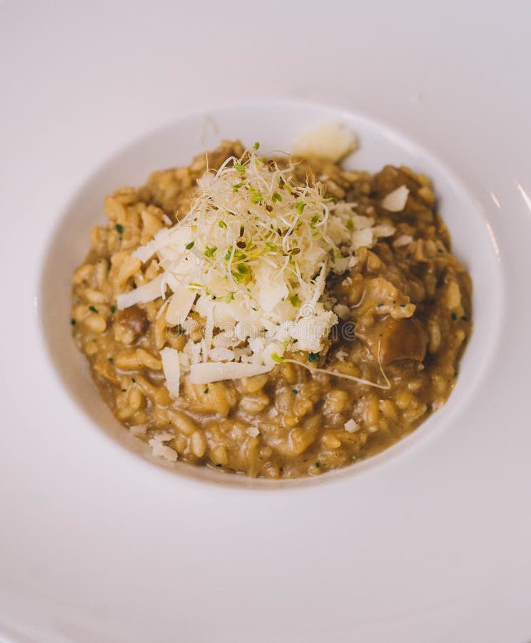 Parmesan Risotto on a Deep Plate, Seasoned with Saffron Stock Image ...