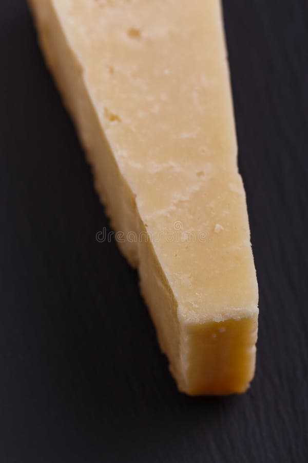 Parmesan Slice on a Stone Slate Plate Stock Photo - Image of gourmet ...