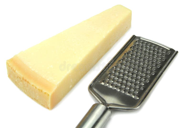 Parmesanost och rivjärn fotografering för bildbyråer. Bild av skiva ...