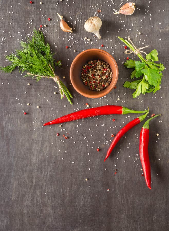 Parsley Dill Pepper and Garlic in a Dark Wooden Table. View from Above ...