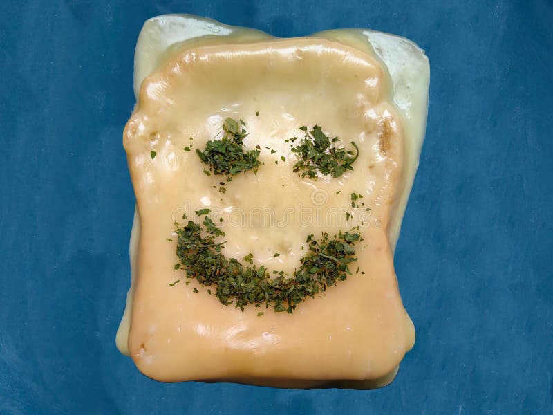 Parsley in the Shape of a Smiley Face on Grilled Cheese on a Blue Plate ...