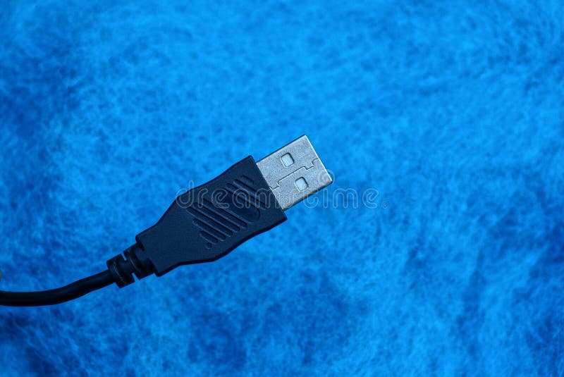 Part of a Black Computer Cord on a Blue Background Stock Photo - Image ...