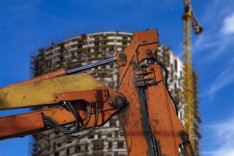 Part of a Construction Machine with Multi-storey Building Under ...