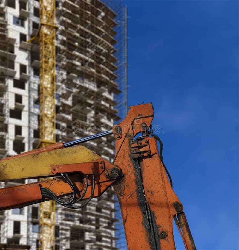 Part of a Construction Machine with Multi-storey Building Under ...