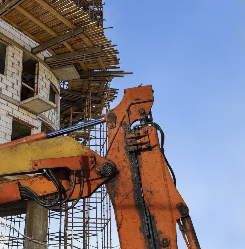 Part of a Construction Machine with Multi-storey Building Under ...