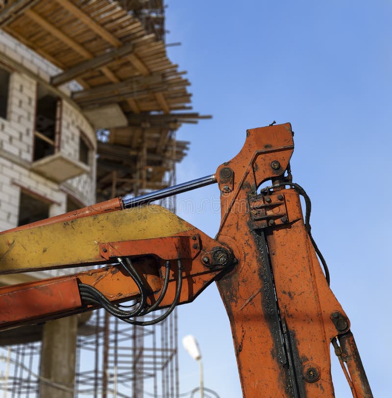 Part of a Construction Machine with Multi-storey Building Under ...