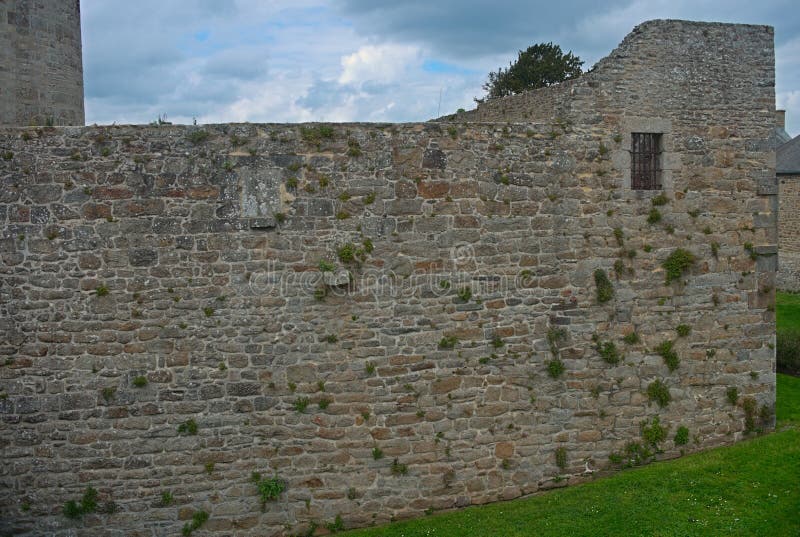 Defensive Stone Wall with Grass-topped Brick Castellation Stock Image ...