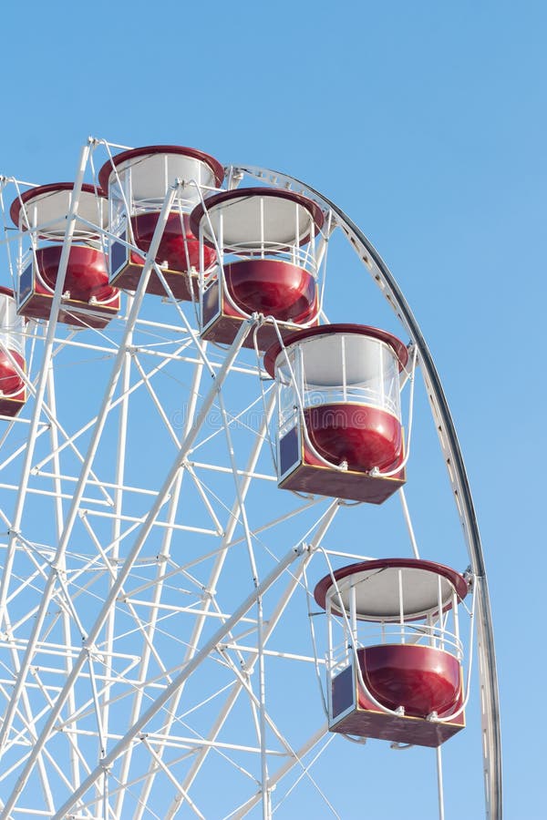 Part of the Ferris Wheel with Red Cabs Against the Blue Sky Stock Photo ...