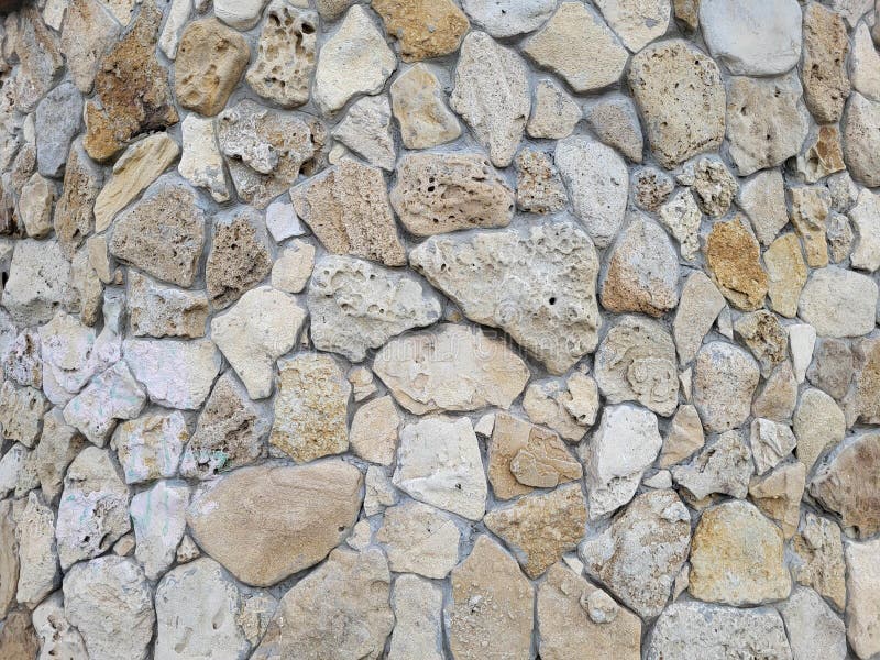 Part of a Gray Wall Made of Irregularly Shaped Stone Blocks Made of ...