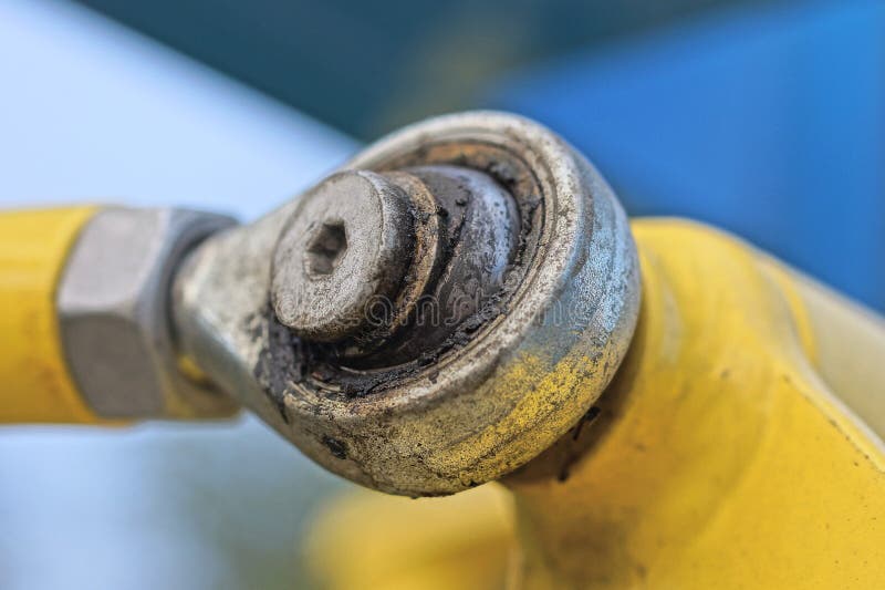 Part of a Gray Yellow Iron Structure with a Hinge in a Metal Pipe Stock ...