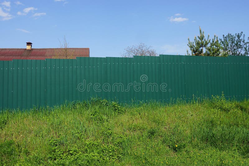 Part of a Green Metal Fence Outdoors in the Grass Stock Image - Image ...