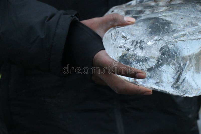 Ice in the hand stock photo. Image of hand, cold, black - 134046822
