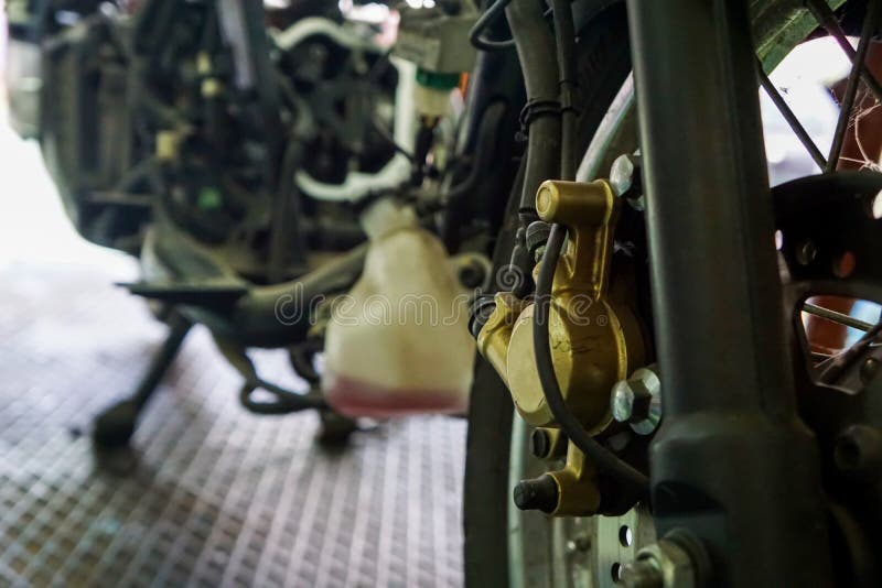 Part of the Motorcycle Engine on the Table for Repair in the Workshop ...