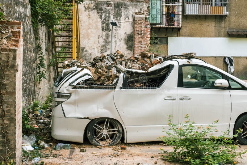 Broken White Vehicle Buried with Old Gray Bricks from Shattered Wall ...