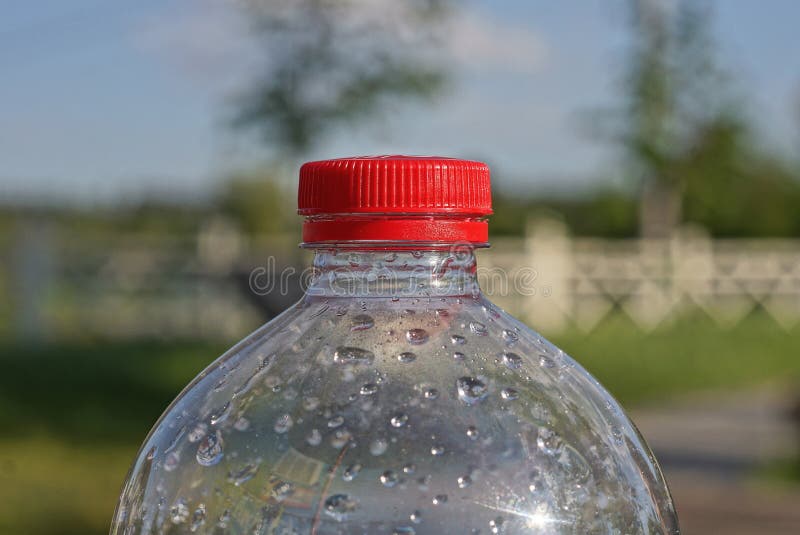 Part of One Plastic Wet Bottle Closed with a Red Cork Stock Photo ...