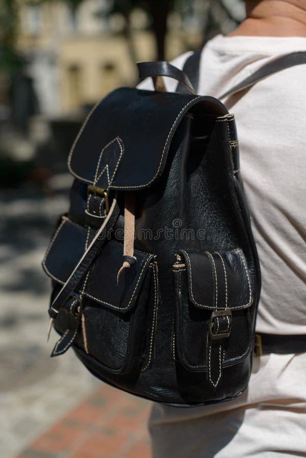 Part Photo of a Man with a Black Leather Backpack with Antique and ...