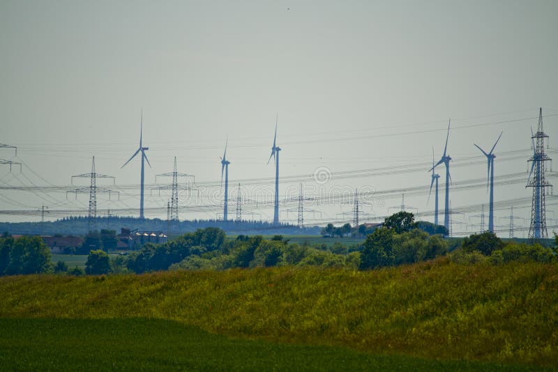 Part of a Power Line with Wind Turbines in Bavaria, Germany Stock Photo ...