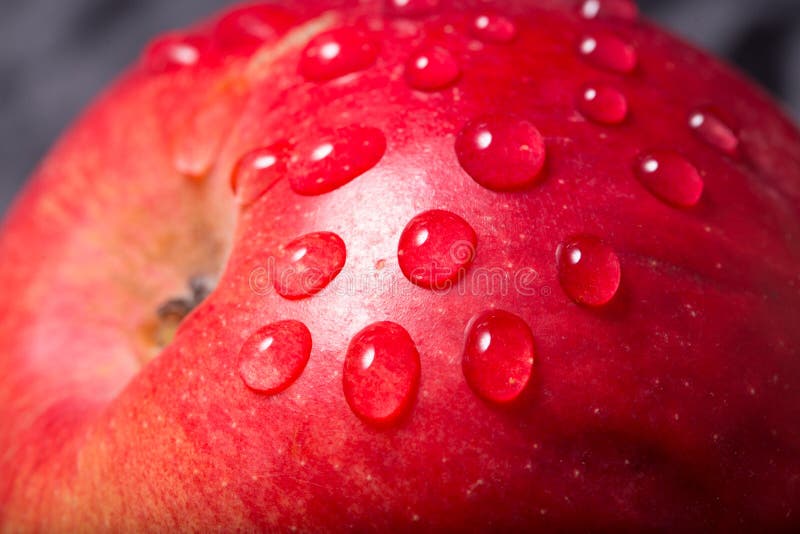 Apple With Water Drops Against Stock Image - Image of colored, autumn ...