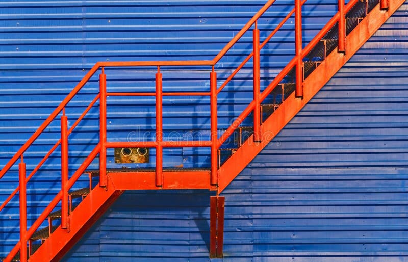 Part of Red Fire Escape on the Blue Wall Stock Photo - Image of ...