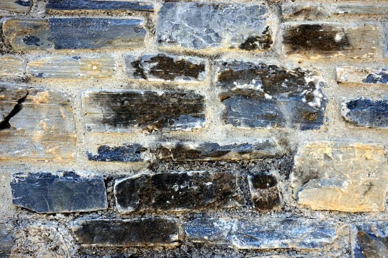 Part of a Stone Wall Made of Carved Stone with Different Structure ...