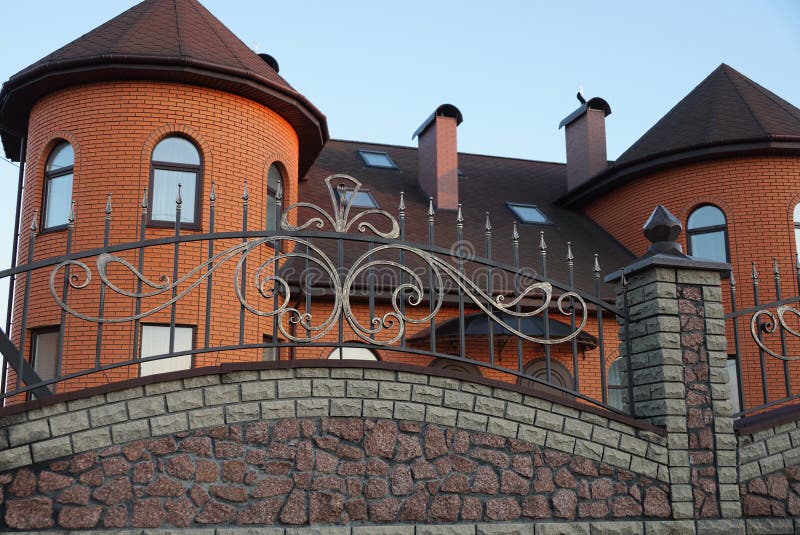 Part of a Stone Wall of a Fence with a Wrought Iron Pattern and Sharp ...