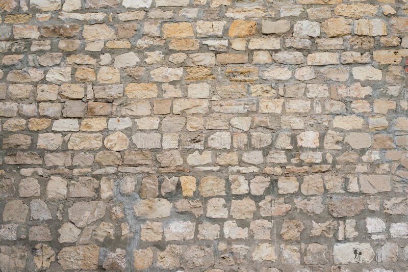 Part of a Uneven Stone Wall with Cement Background, Texture Stock Image ...