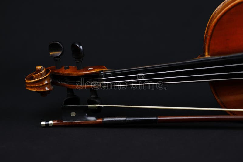 A Part of a Violin and a Violin Bow on Black Background Stock Image ...