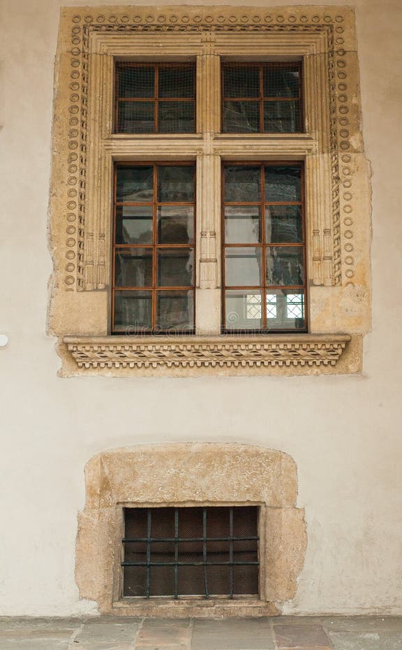 Part of the Wall of an Ancient Castle with Windows with Bars. Stock ...