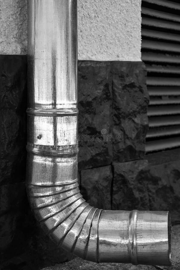 Part of Wall with Galvanized Pipe for Draining Rainwater. Side View ...