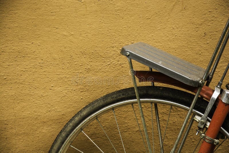 A Part of Wheel Bicycle with a Orange Background Texture Stock Photo ...