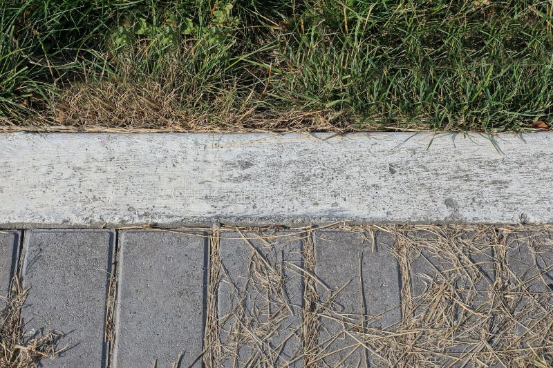 Part of a White Concrete Curb Near the Gray Stone Pavement Stock Photo ...
