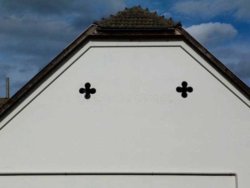 Partial Elevation of Building Attic with Artistic Vents Stock Photo ...
