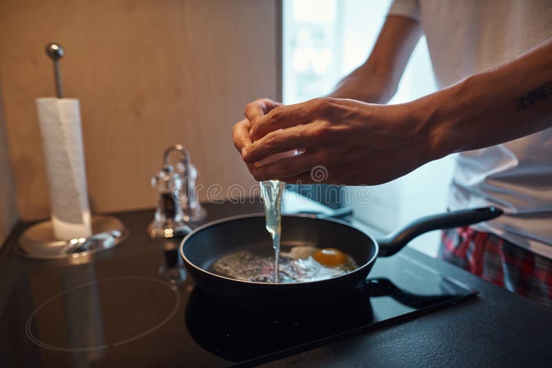 Partial Image of Man Throwing Broken Egg on Pan Stock Image - Image of ...