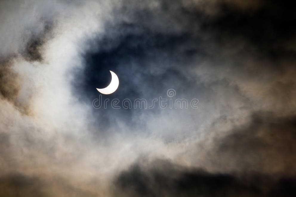Partial solar eclipse stock photo. Image of clouds, space - 17710894