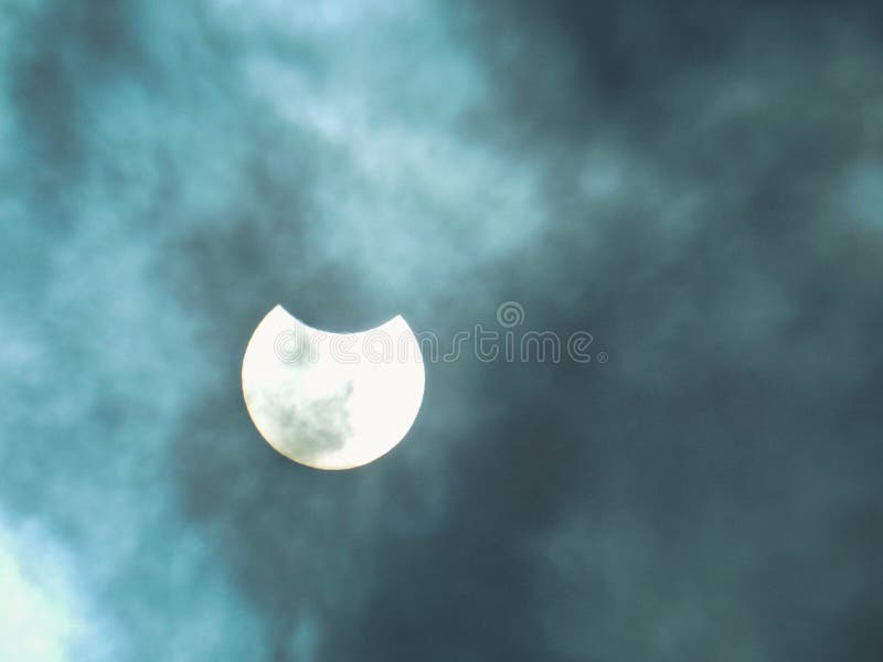 Partial Solar Eclipse in Clouds. Stock Photo - Image of black ...