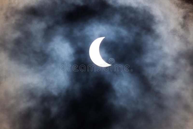 Partial Solar Eclipse through Clouds Stock Image - Image of atmosphere ...
