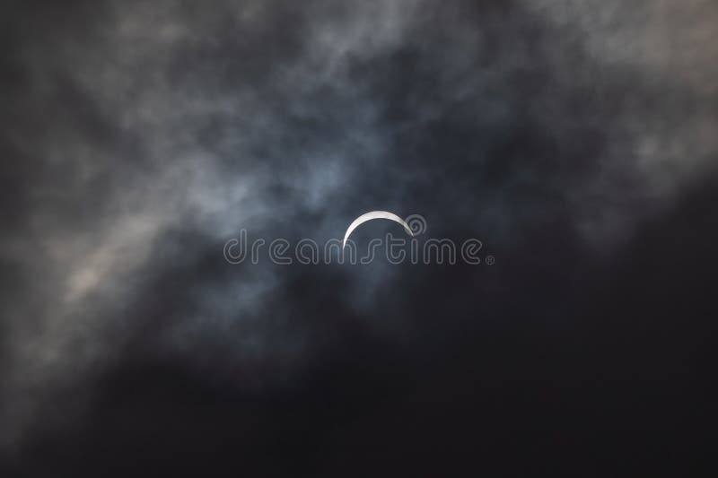 Partial Solar Eclipse - Moon Covers Sun, Dark Clouds, Celestial Drama - Crescent Sun ...