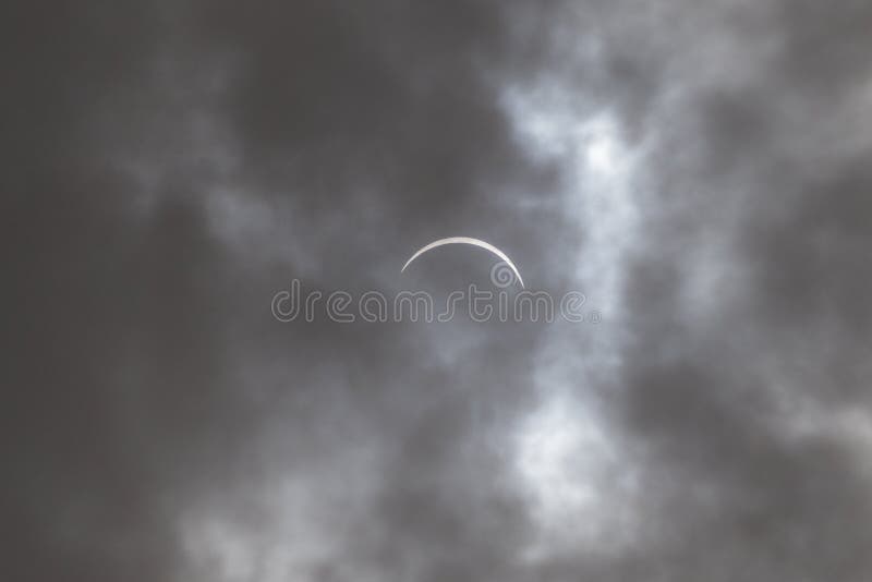Partial Solar Eclipse - Moon Covers Sun, Dark Clouds, Celestial Drama - Crescent Sun ...