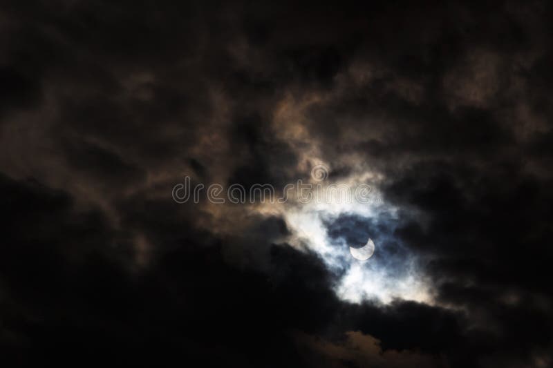 A Partial Solar Eclipse of October 25, 2022 Captured through Moody Dark Clouds, the Maximal ...