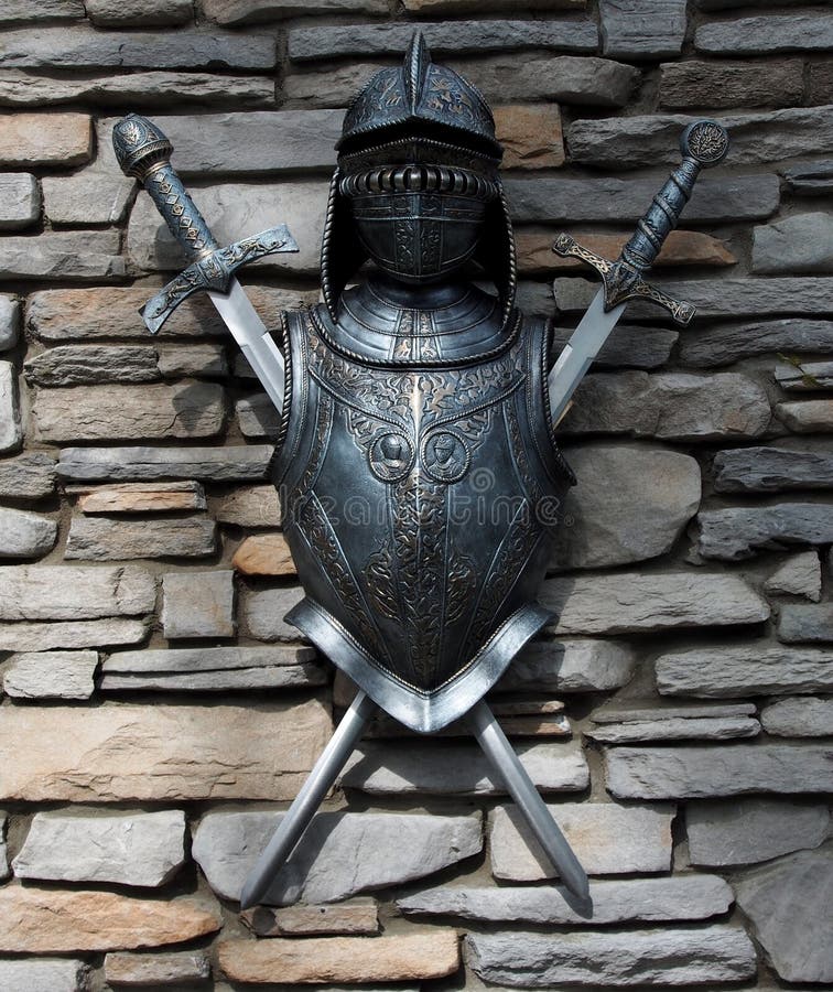 Partial Suit of Armor and Swords Mounted on Stone Wall Stock Image ...