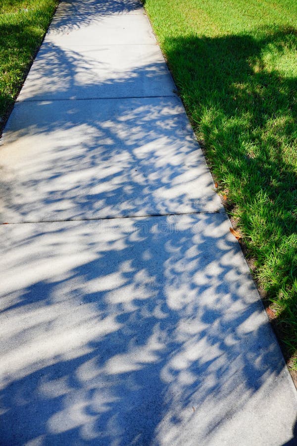 Partial Sun eclipse shadow stock image. Image of night - 293509539